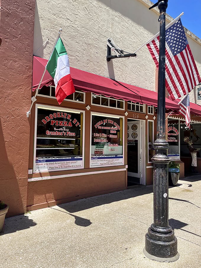 Those flags aren't just decoration – they're a promise of authentic New York-meets-Italy flavor. Pizza Time's storefront is like finding a slice of Brooklyn on St. Augustine's historic streets.