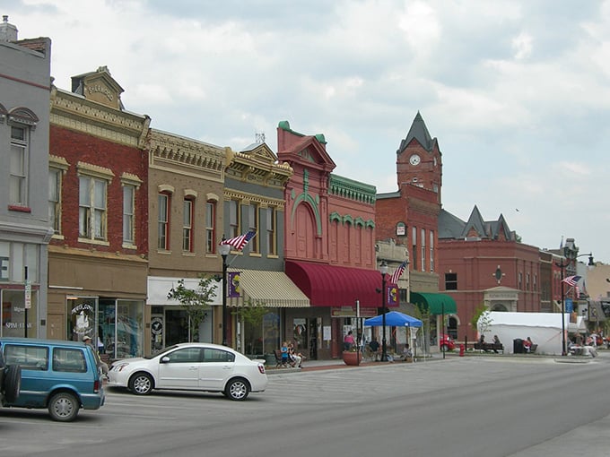 It’s like a Norman Rockwell painting come to life—colorful storefronts, waving flags, and that “everyone-knows-your-name” charm.