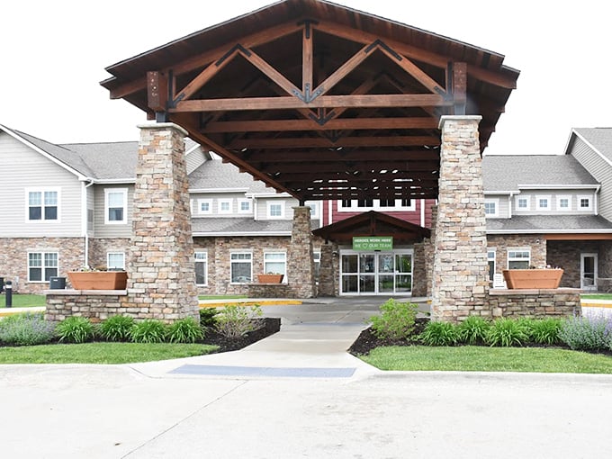 Prairie Vista's grand entrance combines rustic charm with modern convenience in one impressive stone gateway.