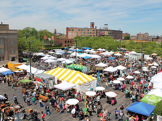 Randolph Street Market from above—a patchwork quilt of white tents where vintage hunters gather like bees to particularly stylish flowers.