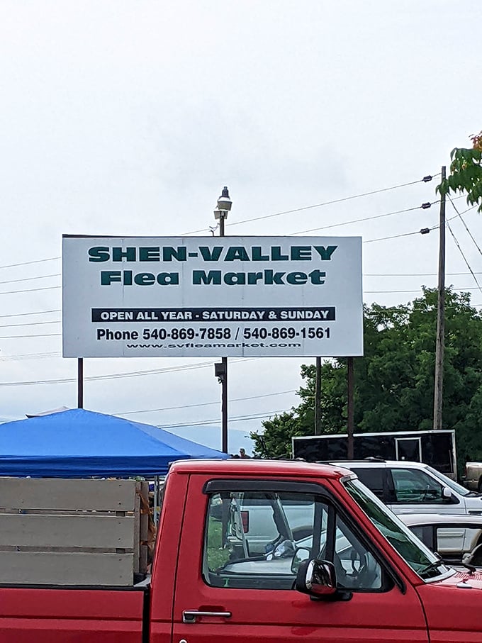 The Shen-Valley Flea Market sign stands tall against Virginia's sky—a beacon for weekend treasure hunters.
