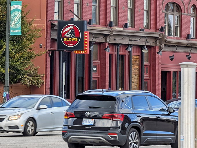 Slows' iconic sign stands proud against Detroit's historic brick backdrop – a modern classic in Michigan's BBQ landscape.