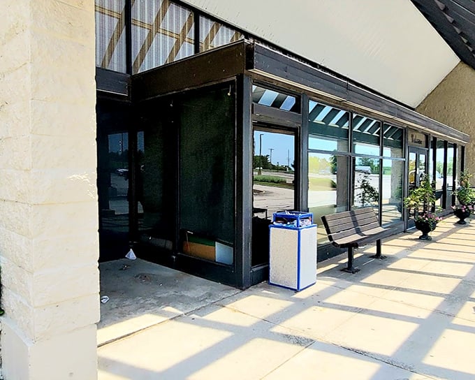 South County Antique Mall's unassuming entrance hides a world where sunshine creates dramatic shadows.