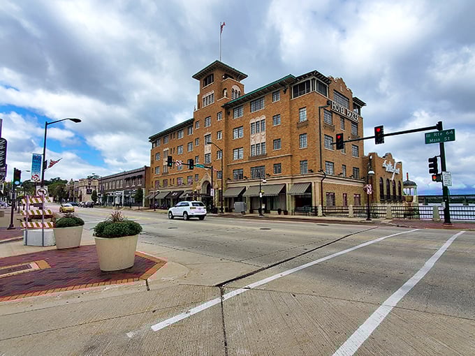 Grand dame of the riverfront! St. Charles' Hotel Baker commands the corner with brick-and-mortar confidence that screams "I've seen it all, darling!"