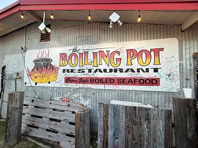 The Boiling Pot's rustic metal exterior and hand-painted sign promise messy, delicious seafood adventures ahead.