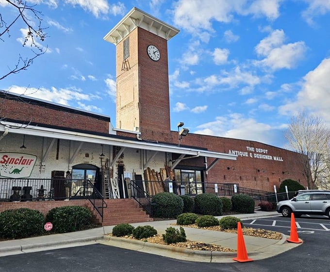 The Depot's iconic clock tower stands sentinel over decades of history, now housing treasures instead of textiles in this Concord landmark.
