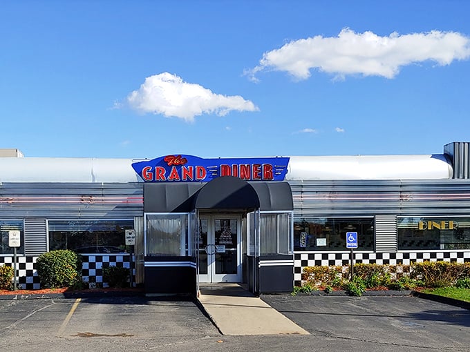 The Grand Diner's gleaming silver exterior shines like a chrome time capsule from the golden age of roadside dining.