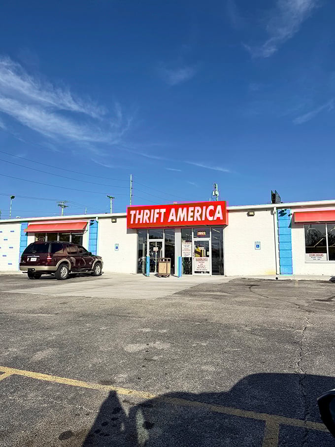 Thrift America's patriotic red sign pops against the white building—as American as apple pie and incredible bargains.