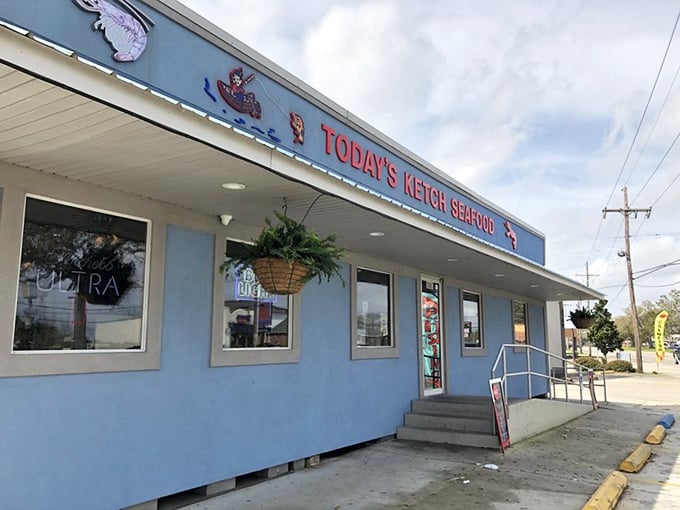 That cheerful blue exterior and seafood artwork promise the kind of neighborhood gem where everyone feels welcome inside.