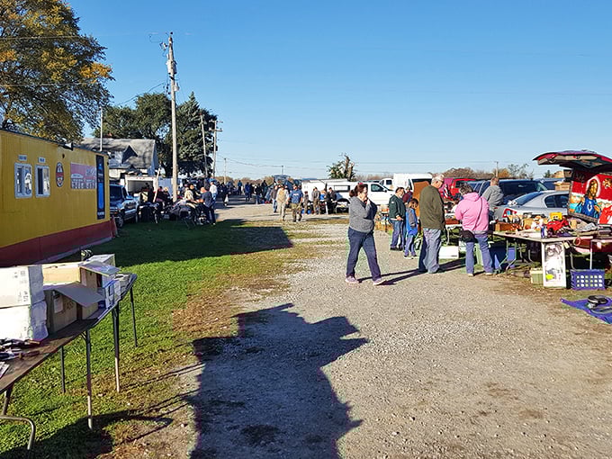 Uncle John's outdoor vendors create a patchwork of possibilities under clear Indiana skies, where paths lead to unexpected finds.