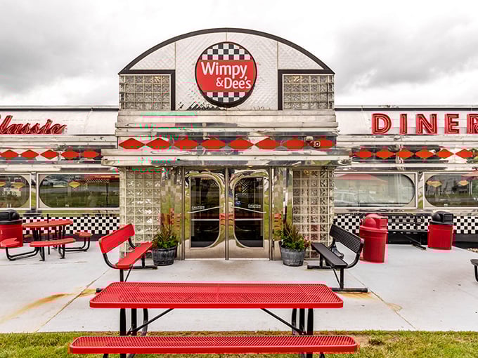 The classic stainless steel exterior of Wimpy & Dee's isn't just architecture—it's a time machine disguised as a diner, complete with glass block windows.