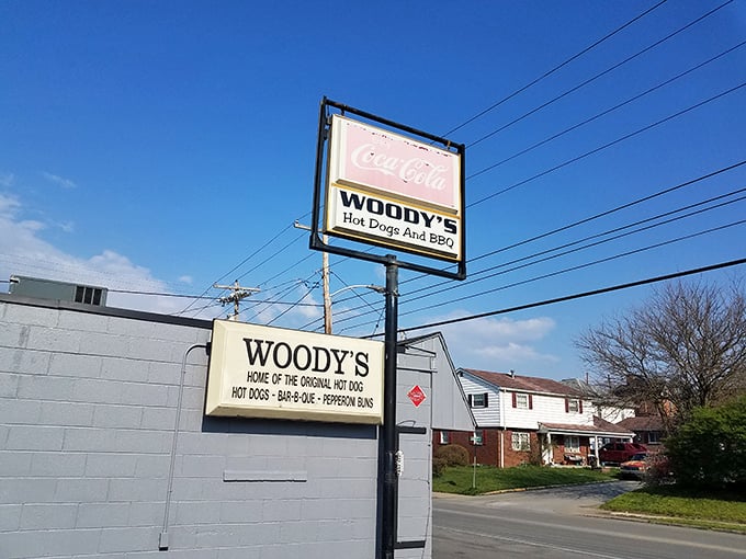 Woody's blue exterior with that classic Coca-Cola sign – like comfort food architecture that promises good things inside.