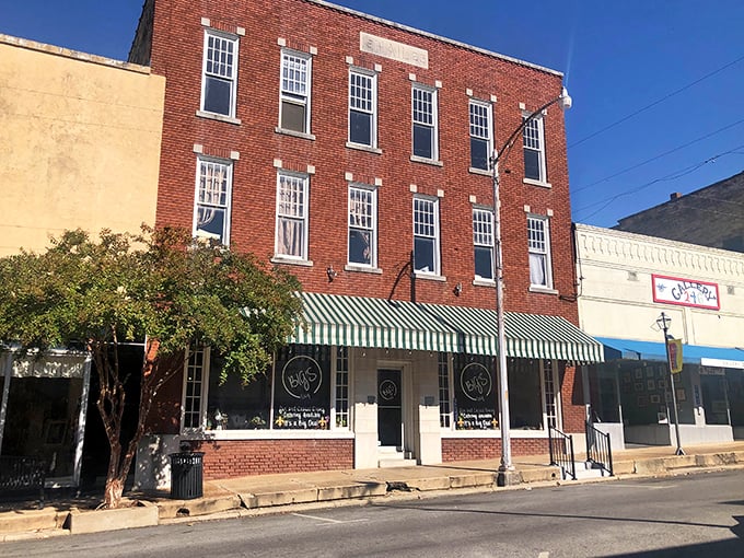 Red brick buildings stand shoulder to shoulder like old friends sharing secrets from Arkansas's golden past.