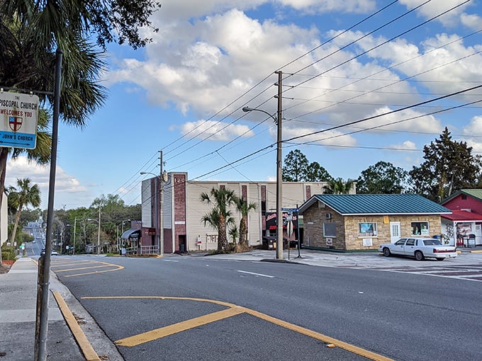 Historic storefronts line streets where local businesses still remember your name and preferences.