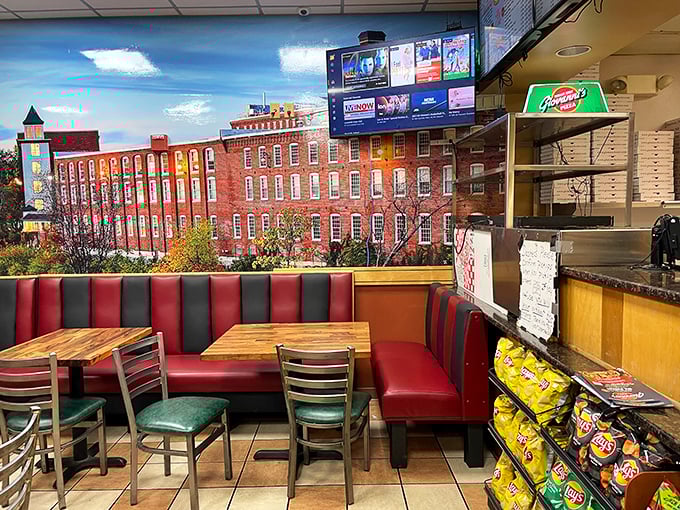 That classic red booth setup screams "authentic neighborhood joint" from every comfortable corner and angle.