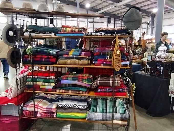 Colorful blankets and vintage treasures stack neatly on display—each item whispering stories from another era, waiting for new listeners.
