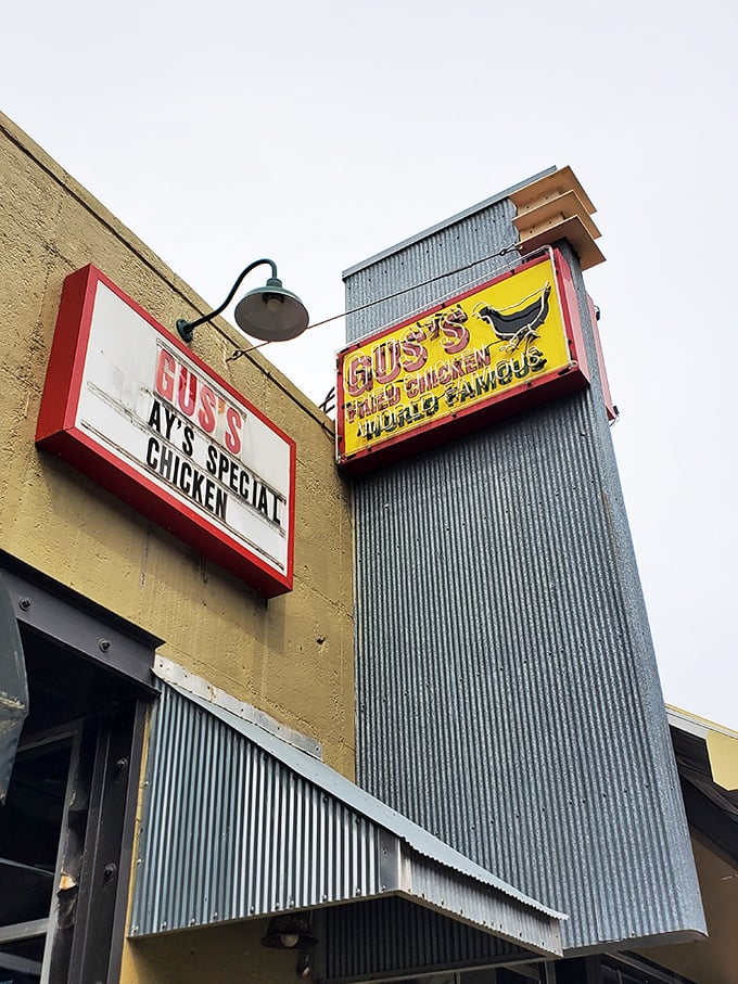 The vintage signage at Gus's promises "World Famous" chicken – a rare claim that actually delivers.