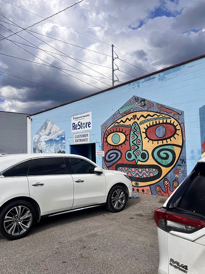 Art meets thrift at this vibrant ReStore entrance. That face mural seems to say, "Come in, the deals are fantastic!"