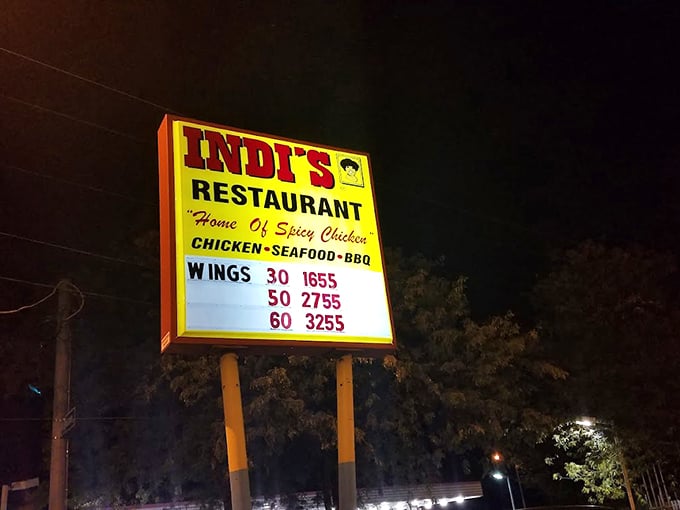 The illuminated menu board tells a delicious story in numbers. 30 wings, 50 wings, 60 wings—math has never been so appetizing.