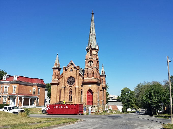 Holy affordable, Batman! Keokuk's gothic church towers over a town where dining out costs less than a streaming subscription. Divine savings indeed!