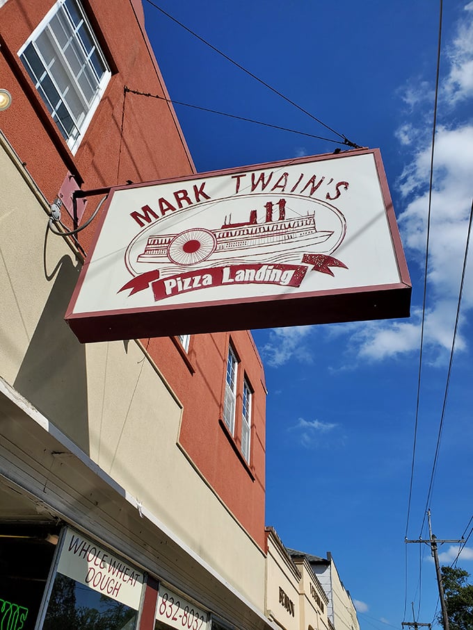 The charming sign at Mark Twain's Pizza Landing promises adventure for your taste buds – no life jacket required.