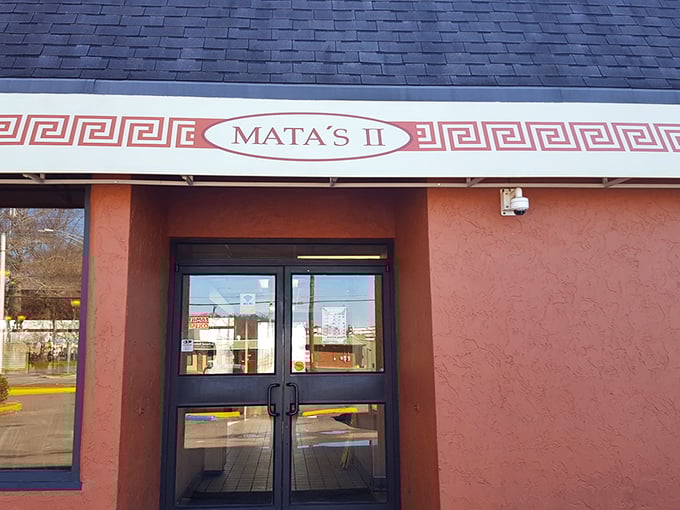 That bold Greek key border frames more than just a sign; it frames a promise of flavor inside Mata’s II.