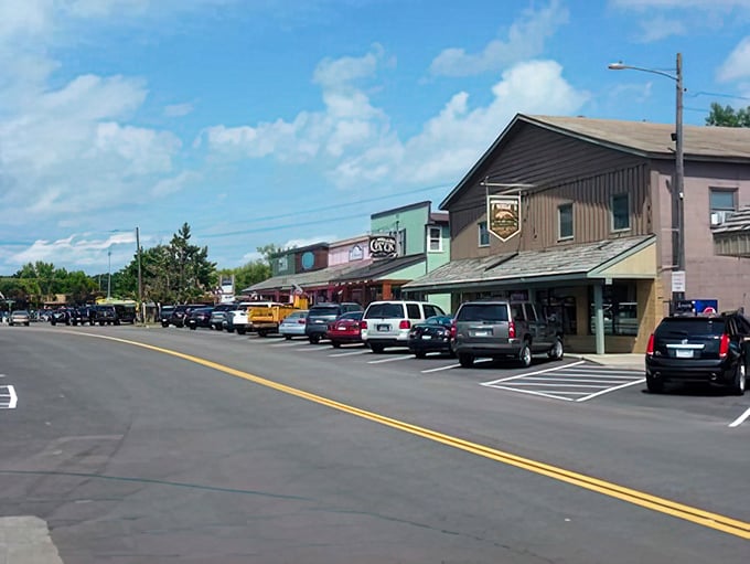 Main Street hums with vacation energy, where every storefront holds treasures for lake country memory makers.