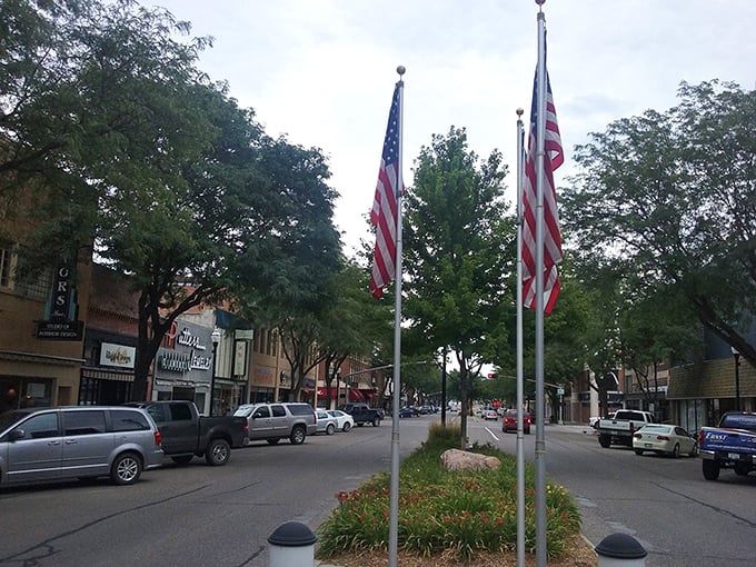 Downtown Norfolk offers small-town charm at its finest — flags flying proudly over a friendly main street.