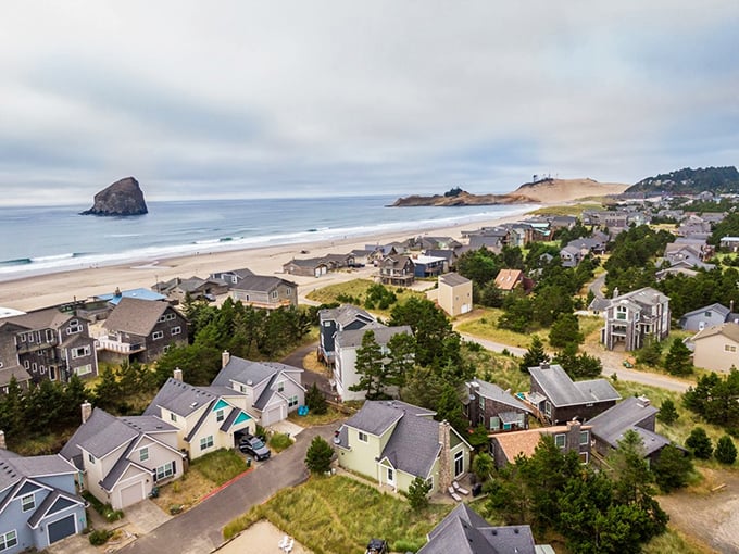 From above, Pacific City looks like it was designed for daydreams—cozy coastal homes, rolling dunes, and the mighty Haystack Rock standing guard offshore.