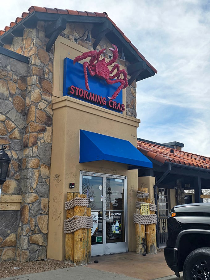 The giant red crab stands guard like a delicious sentinel. Storming Crab's rustic-meets-coastal design promises authentic seafood adventures.