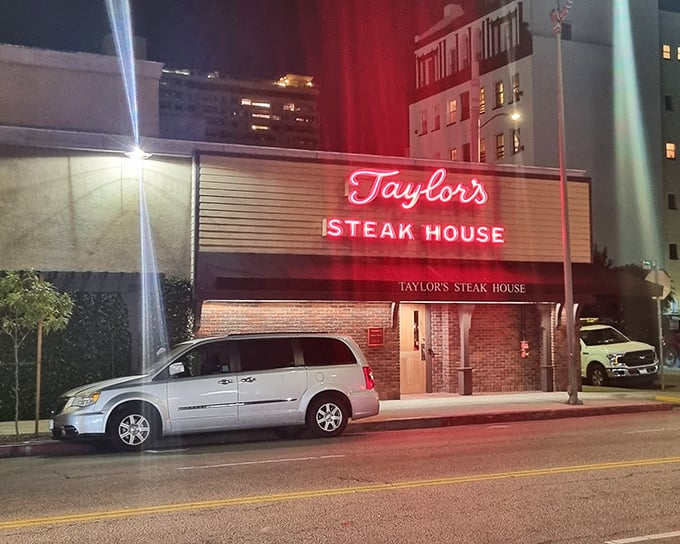 Brick walls and vintage signage whisper stories of old Hollywood deals made over perfect beef.