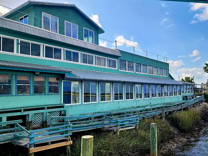 Three stories of waterfront windows mean every seat gets the million-dollar marsh view – now that's thoughtful coastal dining design.