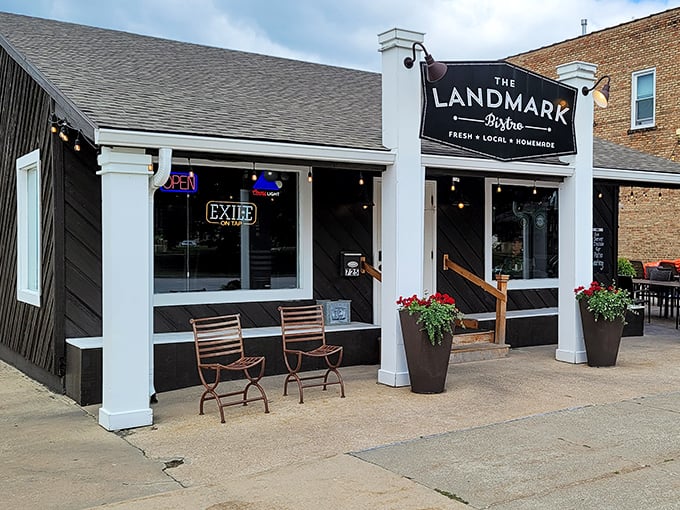 Daytime reveals The Landmark's charming storefront – where those sidewalk seats promise people-watching with your perfectly cooked ribeye.