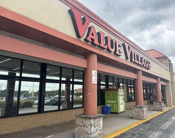 The cheerful coral columns of Value Village stand guard over a kingdom of secondhand treasures.