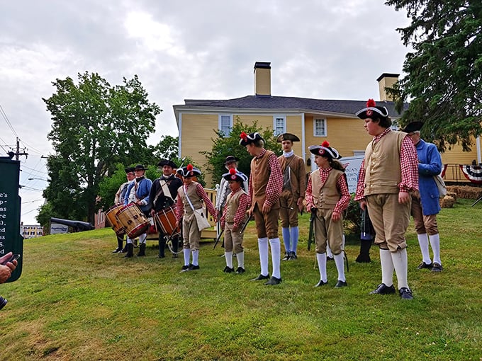 History doesn't just live in books here—these Revolutionary War reenactors bring America's origin story to life with authentic flair and impressive hat game.