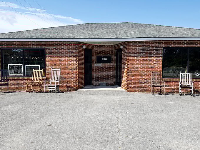 Rocking chairs outside a brick storefront—the universal Southern signal that says "slow down and stay awhile."