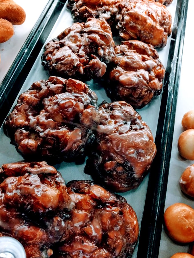 Apple fritters that look like they've been working out—muscular, glazed, and not apologizing for their glorious excess.