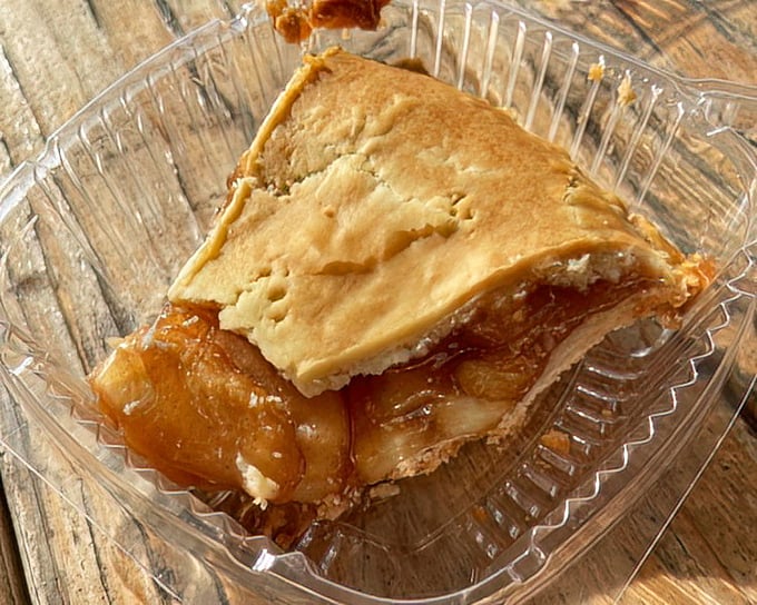 A slice of apple pie that doesn't need Instagram filters—just the sweet tang of cinnamon-kissed apples beneath a buttery crust.