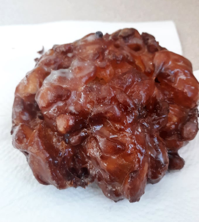 This apple fritter isn't just a donut – it's a glistening, caramelized monument to what happens when apples fulfill their highest purpose.