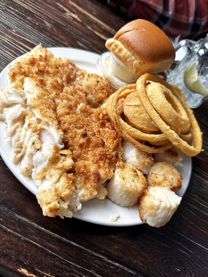 The baked seafood combo plate: where fish, scallops, and onion rings come together like the greatest supergroup in culinary history.