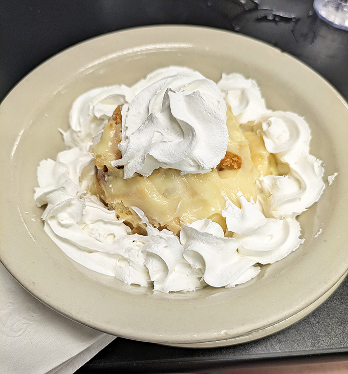 Banana pudding crowned with a cloud of whipped cream—the kind of dessert that makes you close your eyes on the first bite and forget about your diet resolutions.