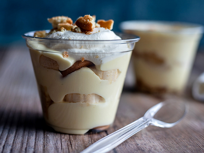 Banana pudding served in a clear cup—because they want you to see the layers of happiness before you dive in.