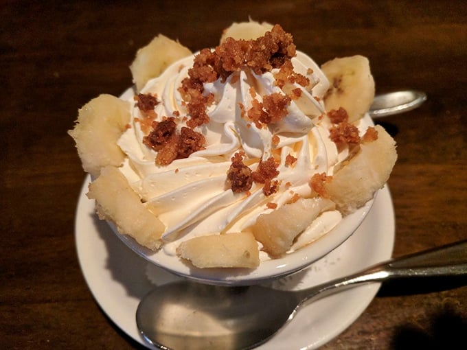This isn't just dessert; it's a cloud of whipped cream topped with banana and what appears to be candied bacon – proof that angels work in Irish kitchens.