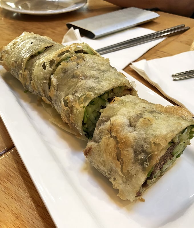 The beef roll – where flaky scallion pancake meets tender five-spice beef in what might be the world's most sophisticated wrap.