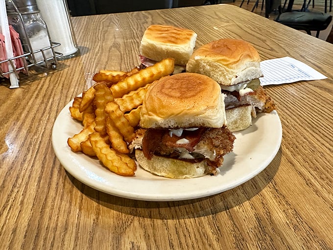 Sliders that mean business – no pretentious "small plates" here, just honest sandwiches with crinkle-cut fries that snap with each bite.