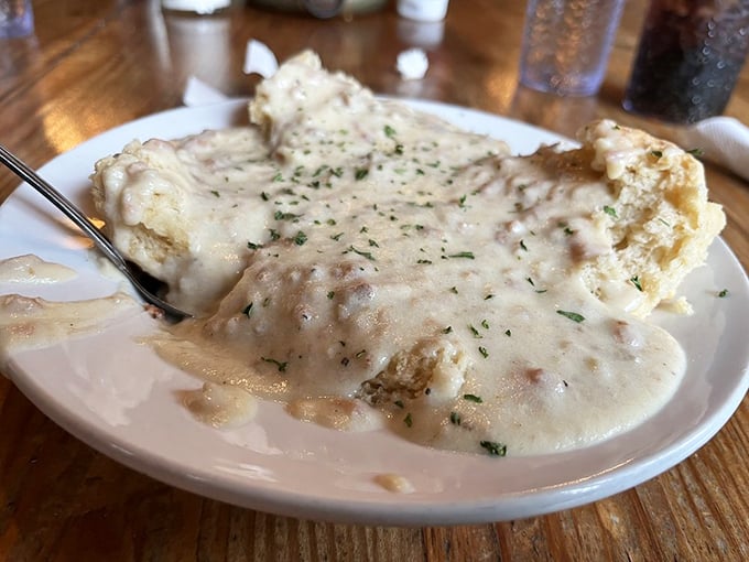 Behold, the blanket of creamy gravy that dreams are made of. These biscuits aren't just covered – they're tucked in for a delicious nap.