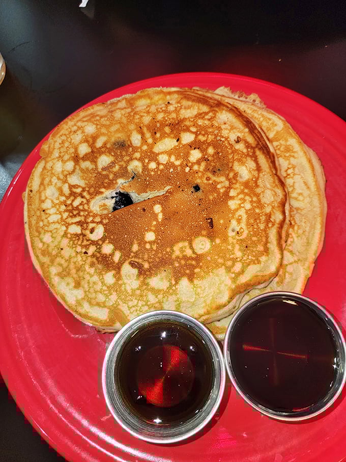 Blueberry pancakes that would make your grandmother jealous—perfectly golden with just the right amount of fluff factor and served with twin cups of syrup.