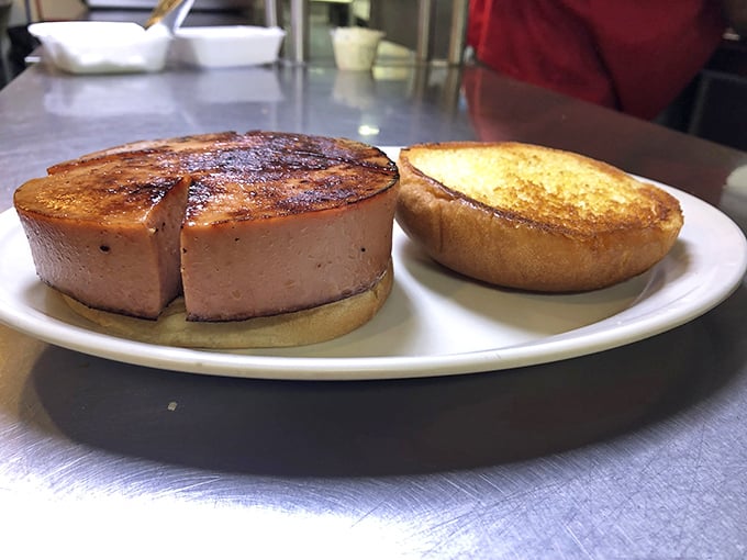 The bologna sandwich – childhood nostalgia upgraded with thick-cut meat that's been kissed by the grill until the edges curl in delight.
