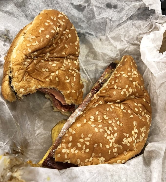 The half-eaten burger tells the real story—patience for photography lasts exactly two seconds when faced with this level of deliciousness. Some pleasures simply can't wait.