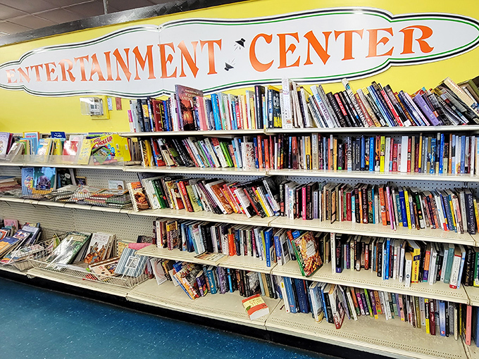 The "Entertainment Center" sign promises literary adventures at pocket-change prices. Someone's abandoned beach read could become your next favorite novel.